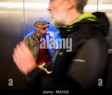 Male busker fort william underpass entertains as strangers pass by ...