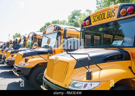 School buses lined up in front of elementary school in the small North ...