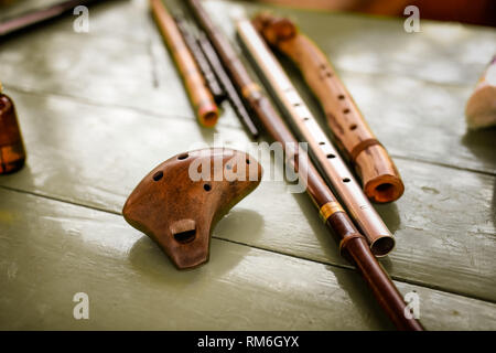Different folk flutes from wood and steel Stock Photo - Alamy