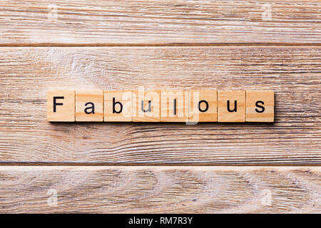 Fabulous word written on wood block. Fabulous text on wooden table for ...