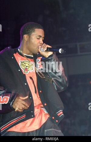 Singer Naz is shown while performing on stage during a concert ...