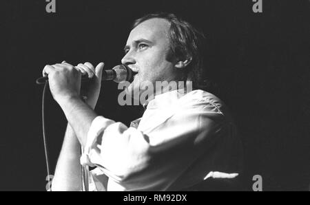 Genesis vocalist Phil Collins is shown performing on stage during a ...