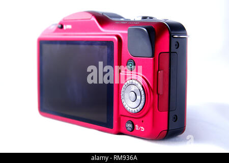 Photo of a red colored digital mirrorless camera Stock Photo - Alamy