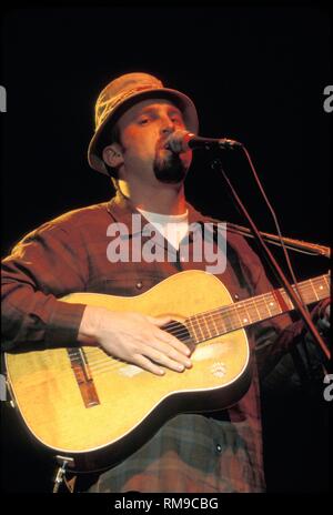 Cake lead guitarist Greg Brown is shown performing on stage during a ...