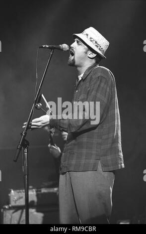 Cake lead guitarist Greg Brown is shown performing on stage during a ...