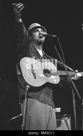 Cake lead guitarist Greg Brown is shown performing on stage during a ...