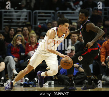 Phoenix Suns' Devin Booker (1) drives past Brooklyn Nets' Keon Johnson ...