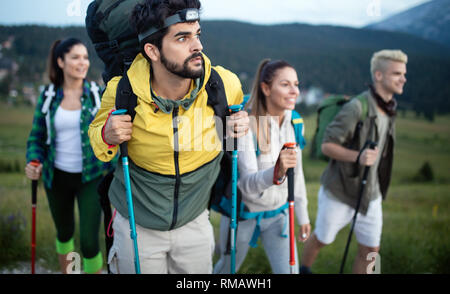 Hard, difficult, tiring and exhausting expedition of friends. Trekking ...