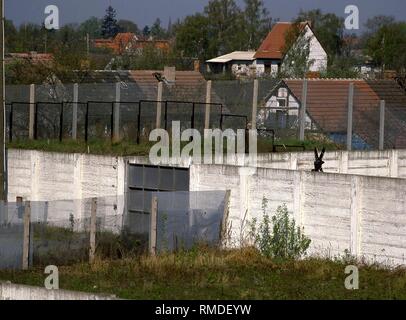 The inner German border with wall, border fence and guard tower between ...