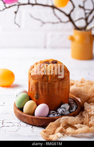 Homemade easter pie with raisins and eggs on plate on a white wooden ...