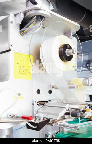 Fragment of the conveyor of sticking labeling machine. Abstract ...