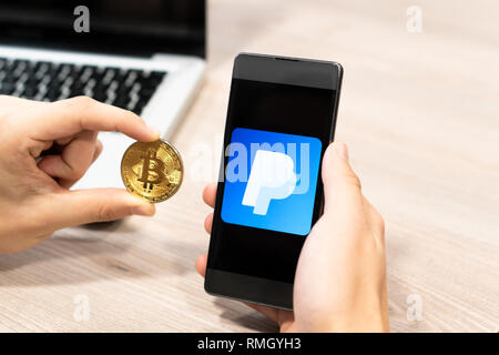 Laptop and phone to buy bitcoin on the Binance crypto exchange during ...