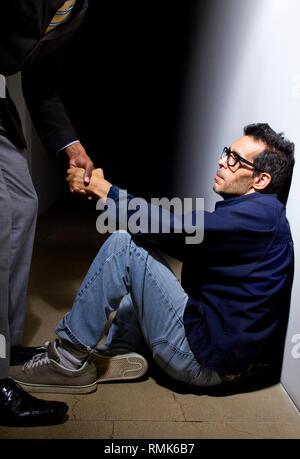 man helping a depressed fellow by offering a helping hand Stock Photo ...