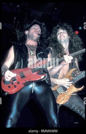 Singer, songwriter and bassist Kip Winger is shown performing on stage ...