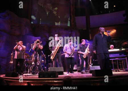 Tower of Power band members are shown performing on stage during a ...