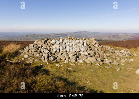 Stone cairn on Cyrn y Brain in the Clwydian Hills above the Horseshoe ...