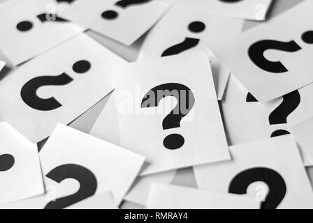 Pile of white cards with black question marks in close-up, full frame ...
