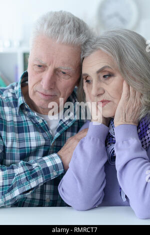 Portrait of a sad senior couple posing Stock Photo - Alamy