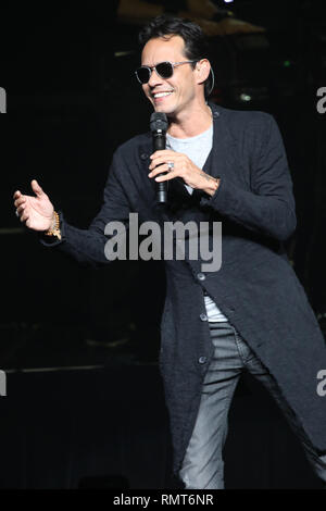 Singer Marc Anthony is shown performing on stage during a "live ...