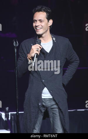 Singer Marc Anthony is shown performing on stage during a "live ...