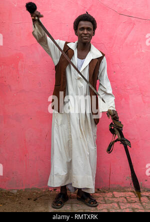 Beja tribe warrior with his sword in the street, Red Sea State, Port ...