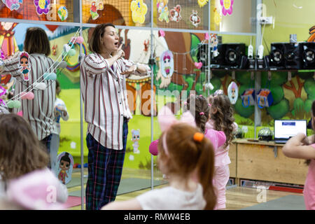Children do yoga in pajamas with a professional teacher Stock Photo - Alamy