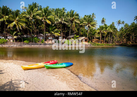Beautiful lagoon with kayak boats at Cola beach resort in Goa, India ...