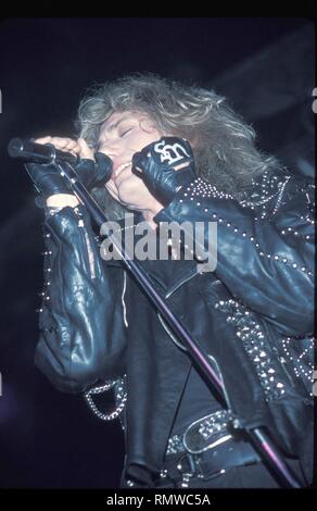 Singer David Coverdale is shown performing on stage during a "live ...