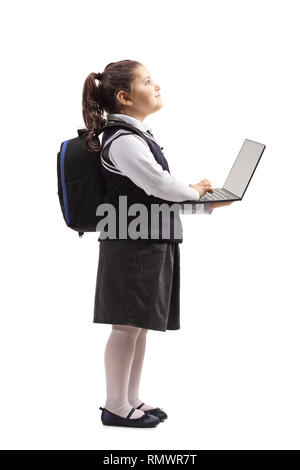 Schoolgirl in school uniform with laptop. Schoolchild, teen student on ...