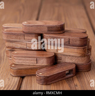 Many wooden usb flash drive on wooden background Stock Photo - Alamy