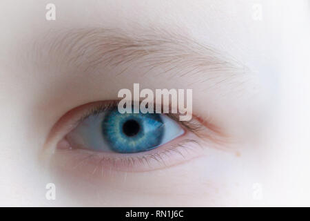 Baby blue beautiful, brooding eyes of a boy Stock Photo - Alamy