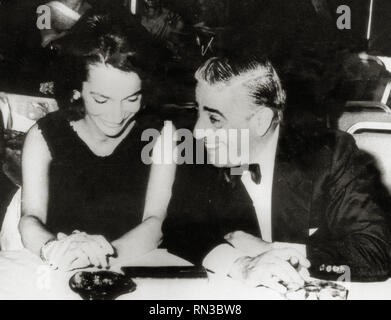 Greek shipping magnate Aristotle Onassis, left, shakes hands with ...