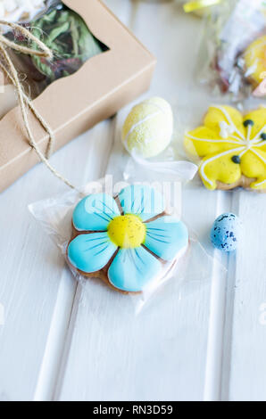 yellow tulips, ginger cookies, willow twigs, decorative eggs in a tray ...