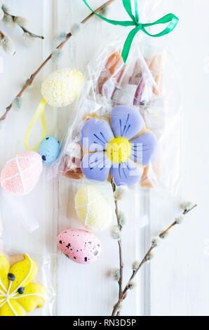 yellow tulips, ginger cookies, willow twigs, decorative eggs in a tray ...