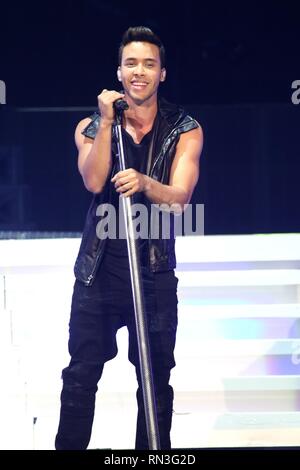 Prince is shown performing on stage during a "live" concert appearance ...