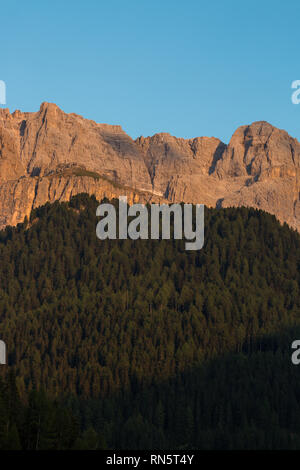 The Enrosadira phenomenon at sunset on the Dolomites of the Sella group ...