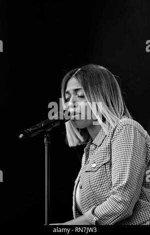 Monochrome image of Mahalia performing live on stage at the 2018 ...