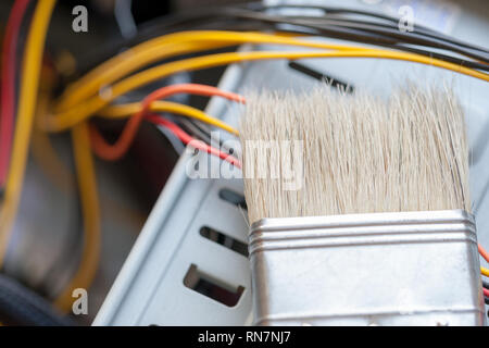 desktop computer dust cleaning with tassel. computer power wires Stock ...