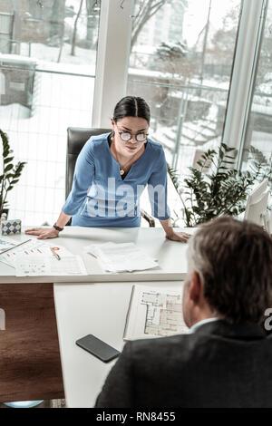 Dark-haired businessman looking confident Stock Photo - Alamy