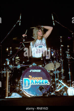 Danger Danger guitarist is shown performing on stage during a "live ...