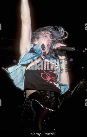 Danger Danger guitarist is shown performing on stage during a "live ...