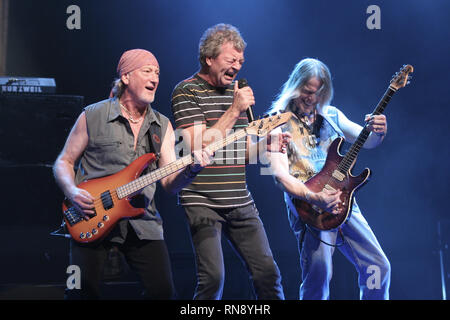 Deep Purple band members are shown performing onstage during a "live ...