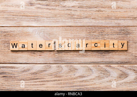 Water scarcity word written on wood block. Water scarcity text on ...