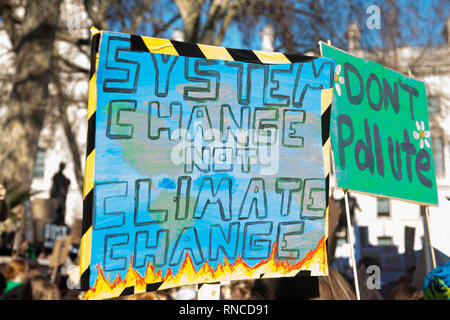 Protestors holding climate change banners at a protest Stock Photo - Alamy