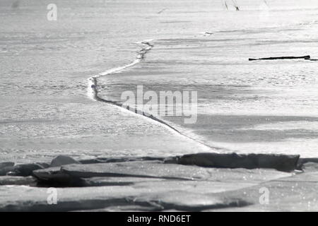 rifts on crystal surface of the frozen sea spring is come Stock Photo ...
