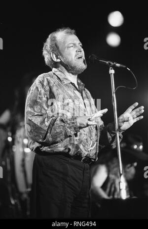Singer Joe Cocker is shown performing on stage during a "live" concert ...