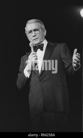 Singer and television personality Perry Como is shown on stage during a ...