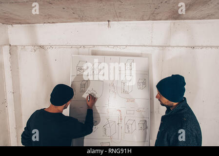 Dangerous thiefs standing in a room and making a plan for heist Stock ...