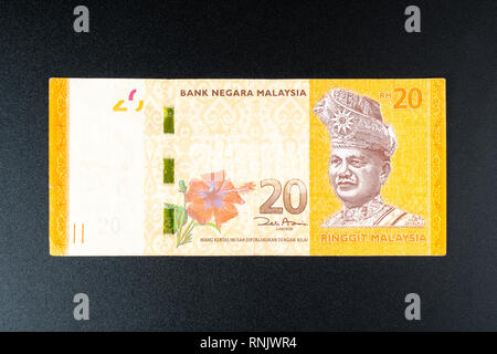 a 20 Malaysian Ringgit banknote on a white surface Stock Photo - Alamy