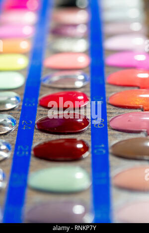 Nail technician: nail care and semi-permanent nail polish Stock Photo ...